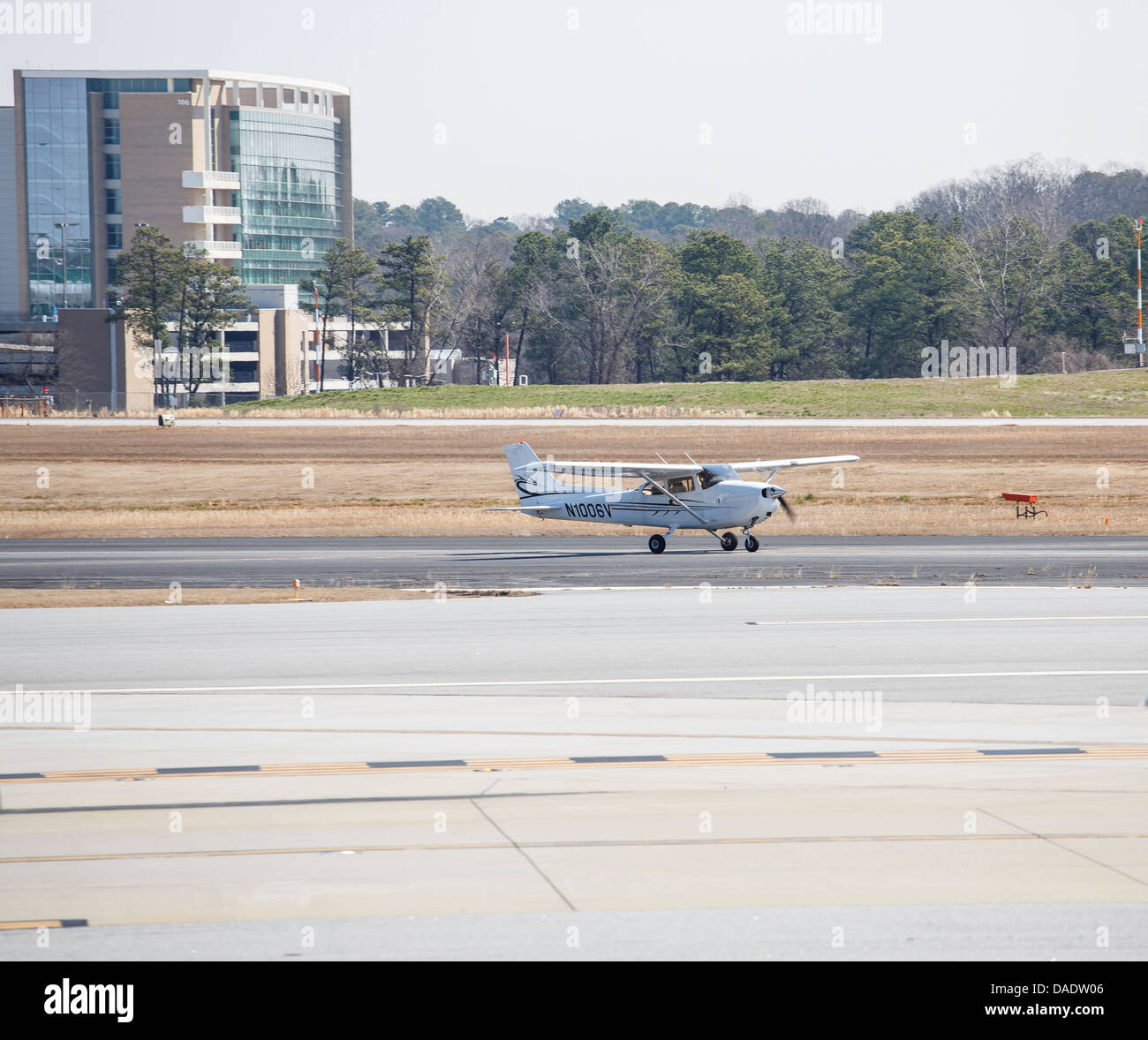 Small private airplane on the runway of a regional airport Stock Photo ...