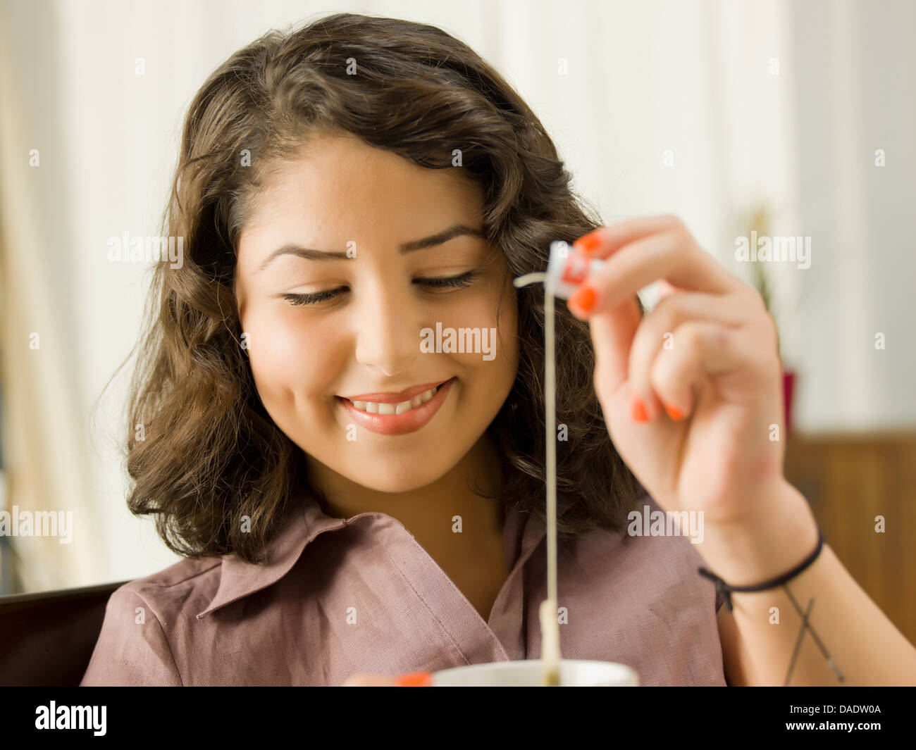 Lifting the cup hi-res stock photography and images - Alamy
