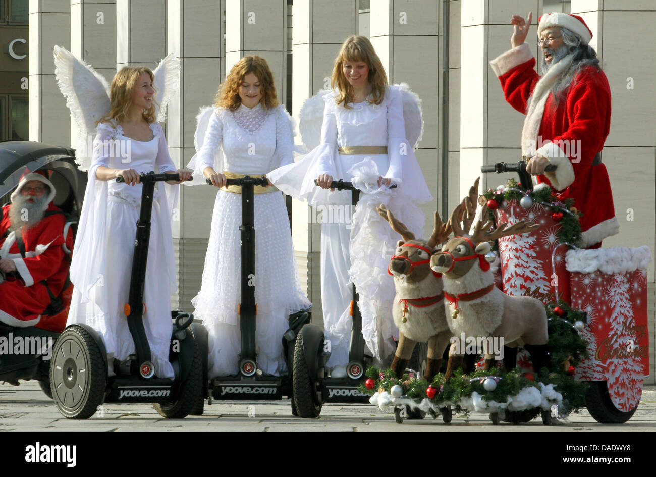 Christmas angels and a Santa Claus pose on Segways in Berlin, Germany ...