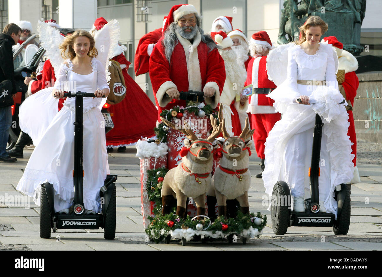 Christmas angels and a Santa Claus pose on Segways in Berlin, Germany ...