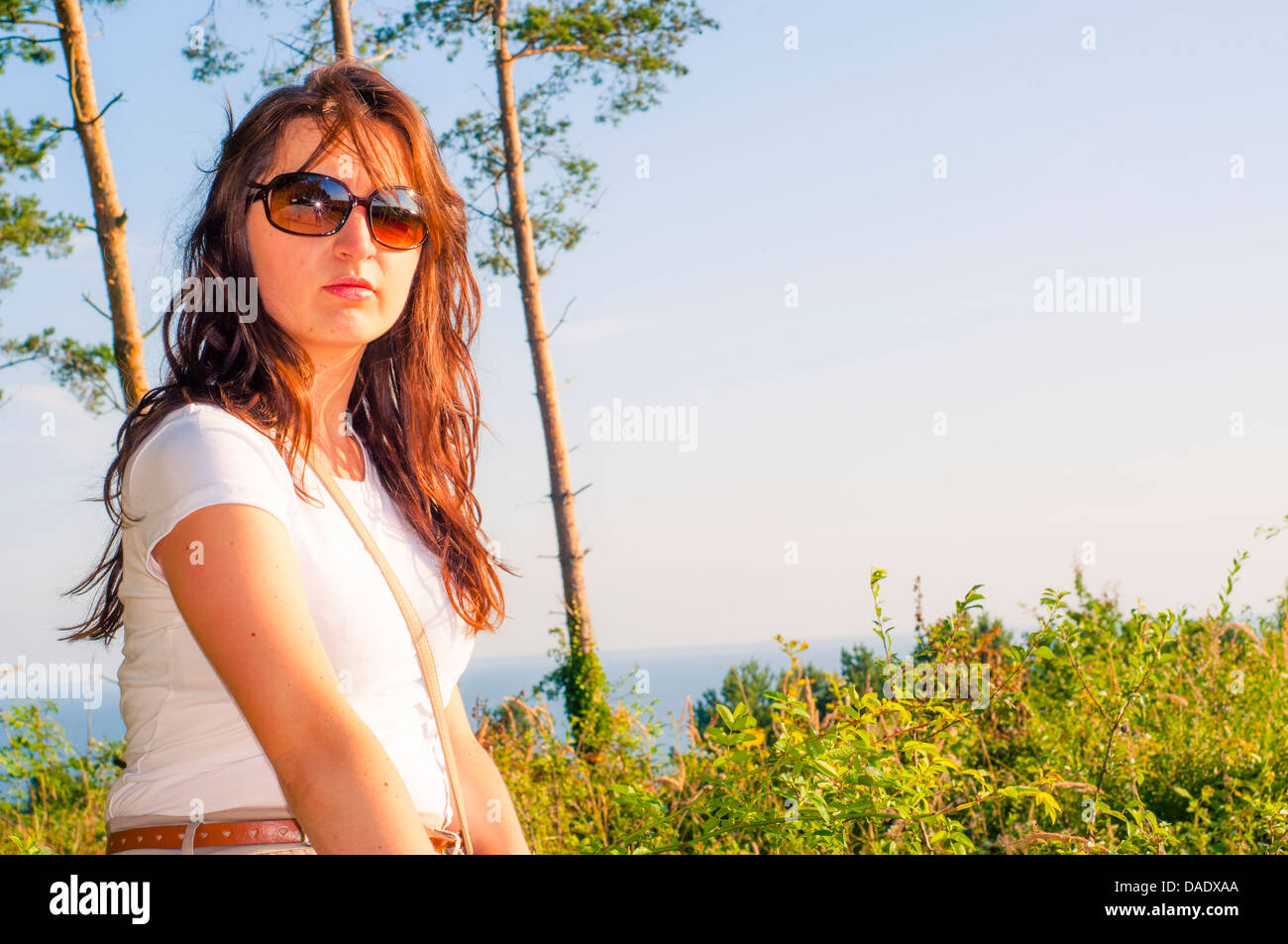 An image girl walking through the forest pathway Stock Photo - Alamy