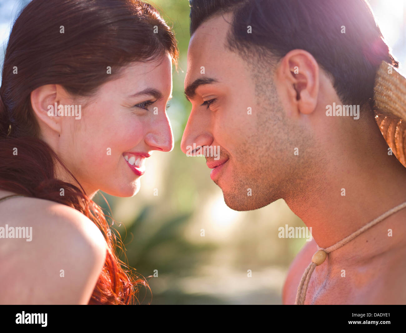 Young couple face to face, smiling Stock Photo - Alamy