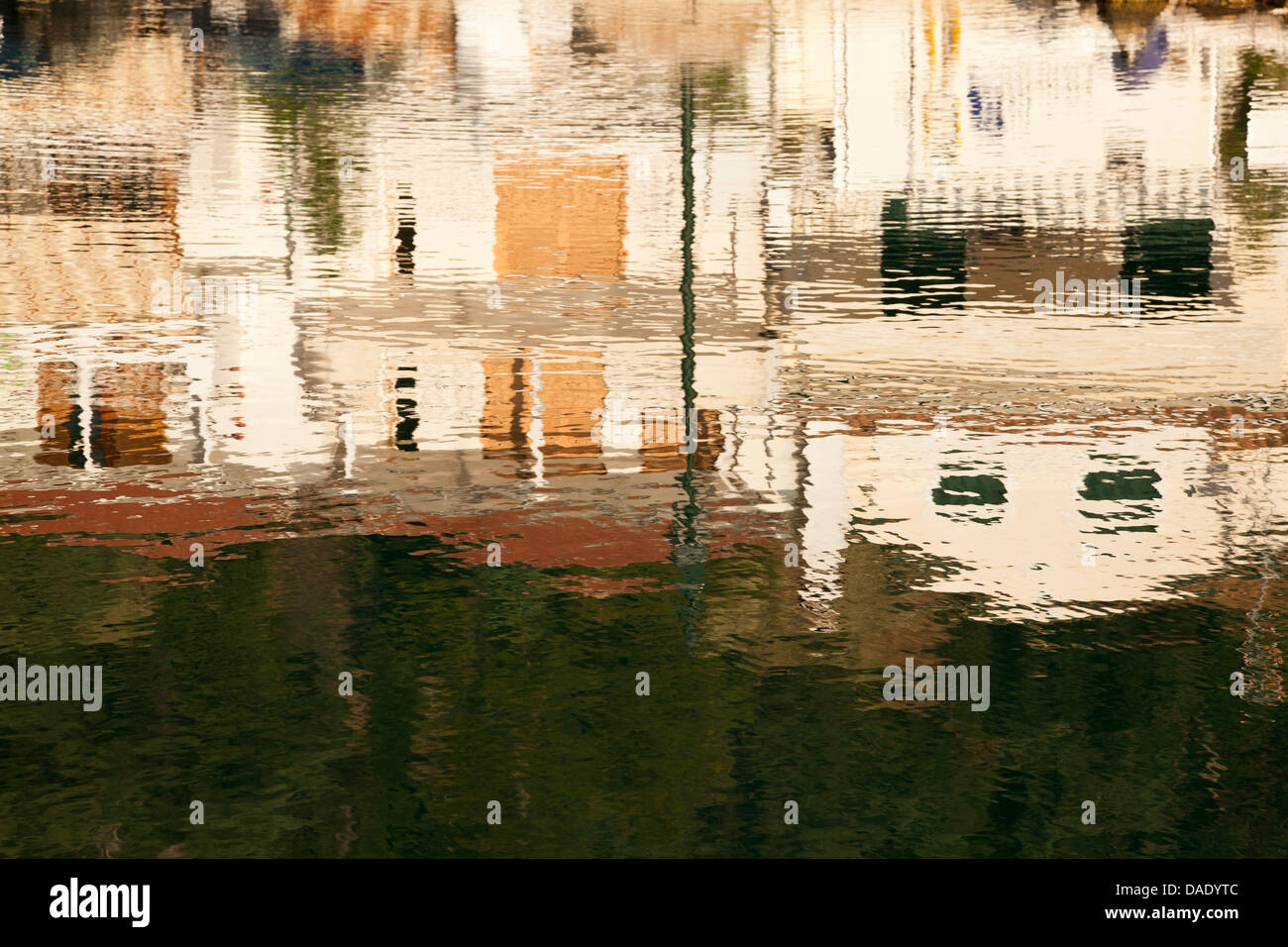 Reflections of waterside houses Stock Photo - Alamy
