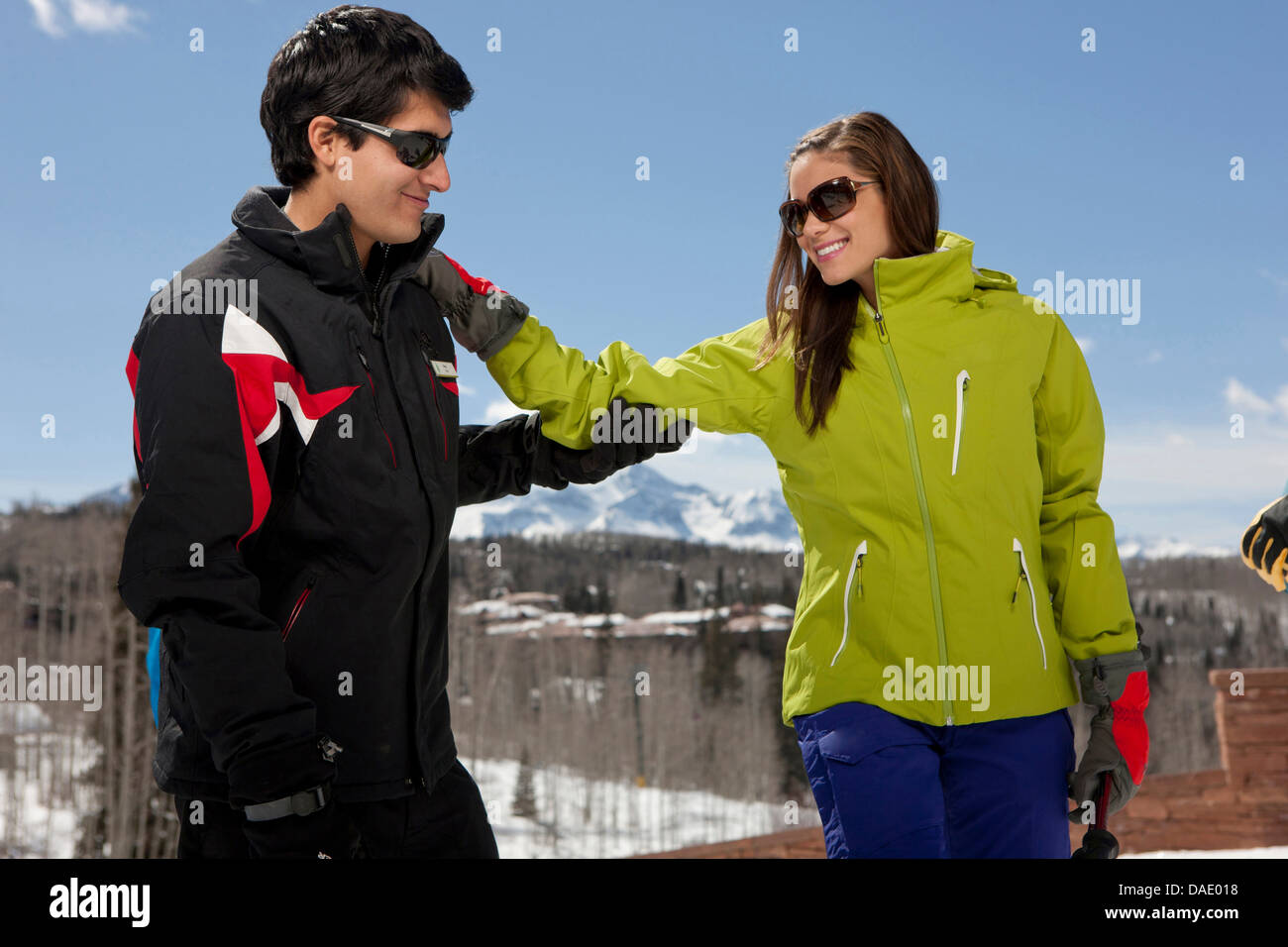Young woman with ski instructor on ski slope Stock Photo - Alamy
