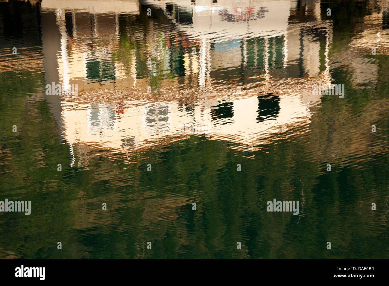 Reflections of waterside houses Stock Photo - Alamy