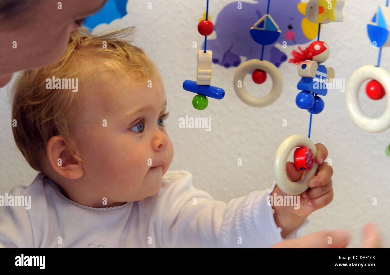 A mother plays with her one-year-old child at the ambulatory care unit ...