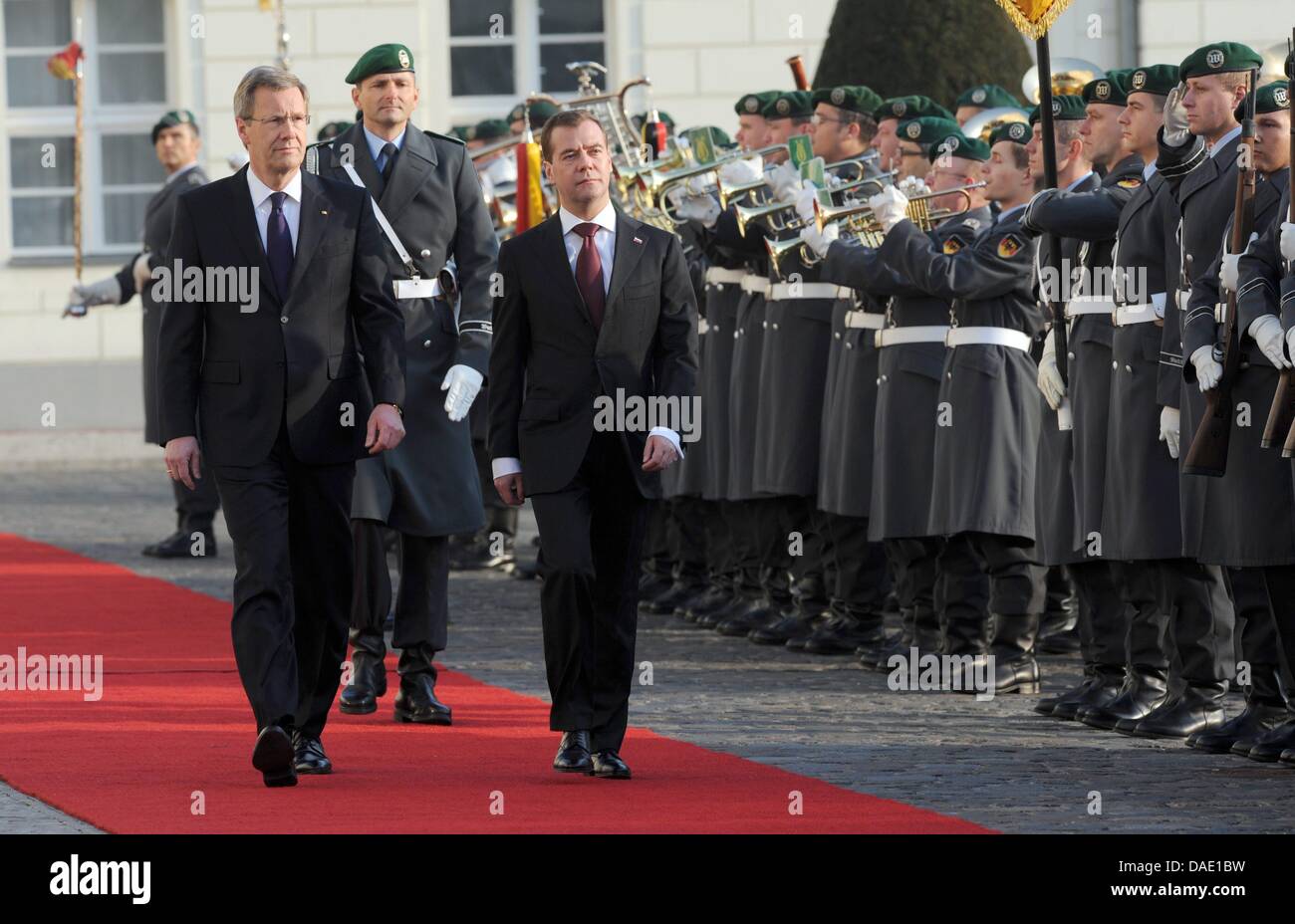 The Russian President Dmitry Medvedev (R) is welcomed with military ...