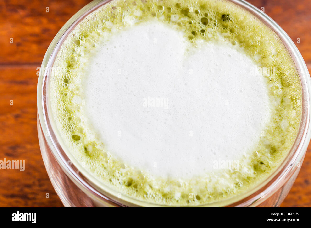 Close up hot matcha green tea latte on wood table Stock Photo - Alamy