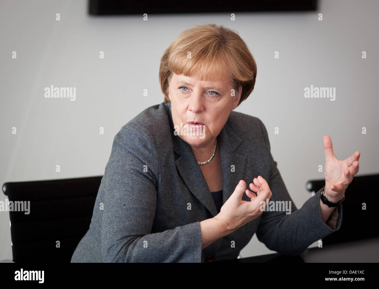 German Chancellor Angela Merkel speaks during an interview with the ...