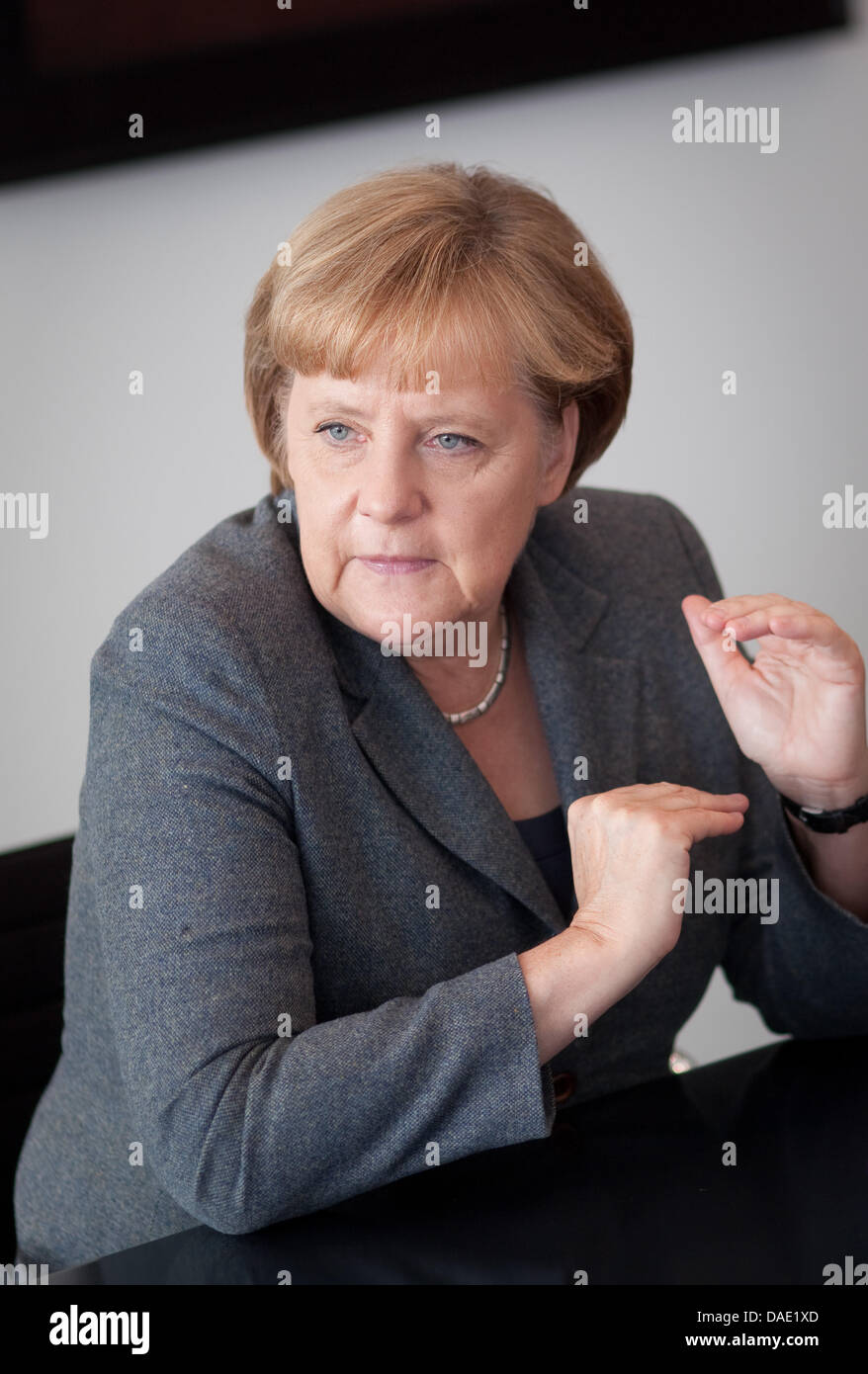 German Chancellor Angela Merkel speaks during an interview with the ...