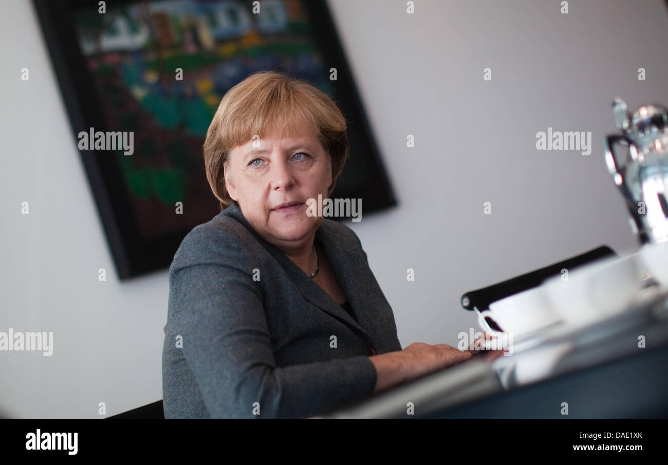 German Chancellor Angela Merkel speaks during an interview with the ...