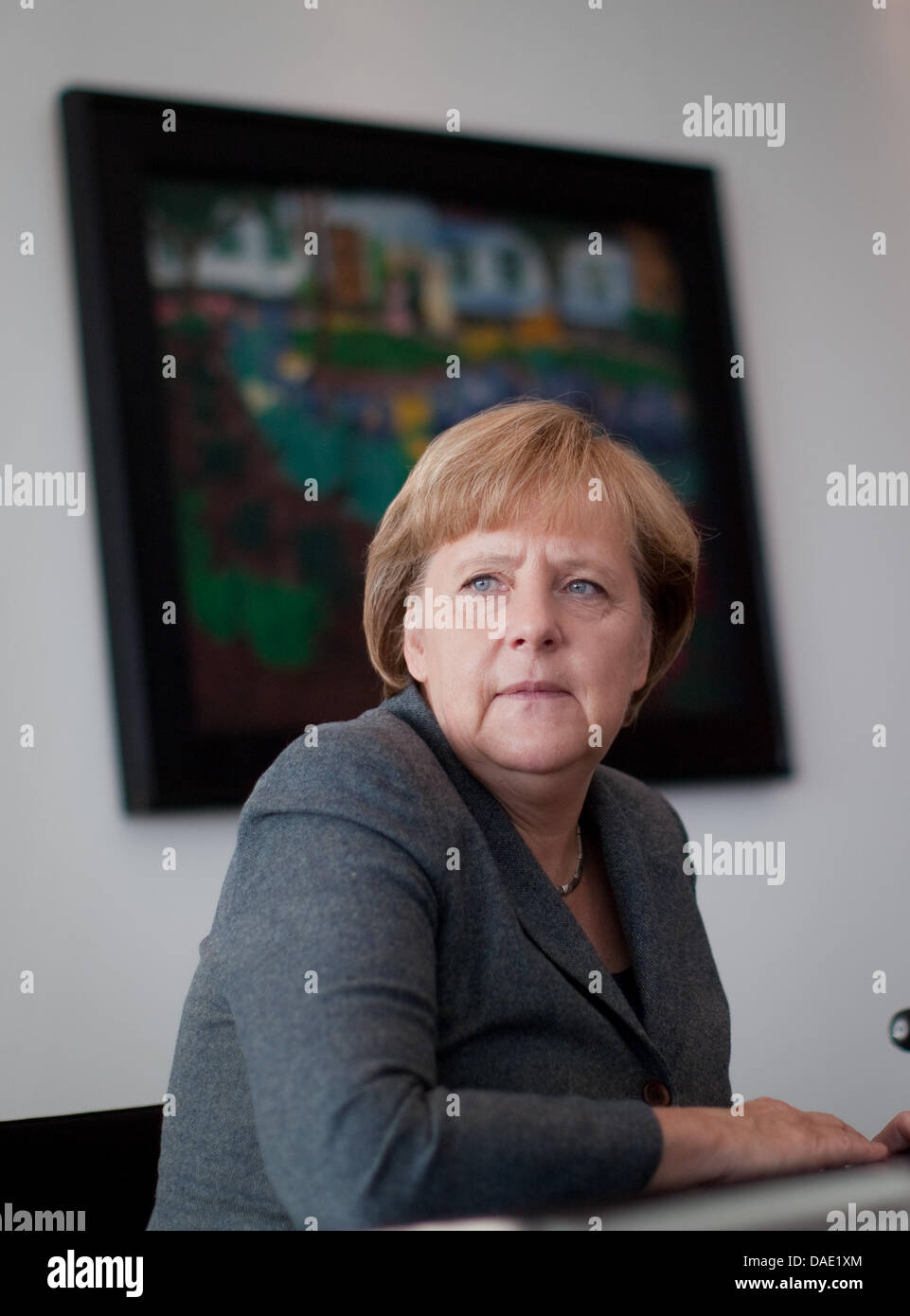 German Chancellor Angela Merkel speaks during an interview with the ...