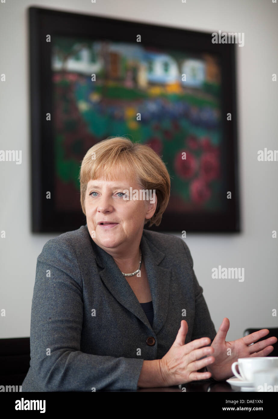 German Chancellor Angela Merkel speaks during an interview with the ...