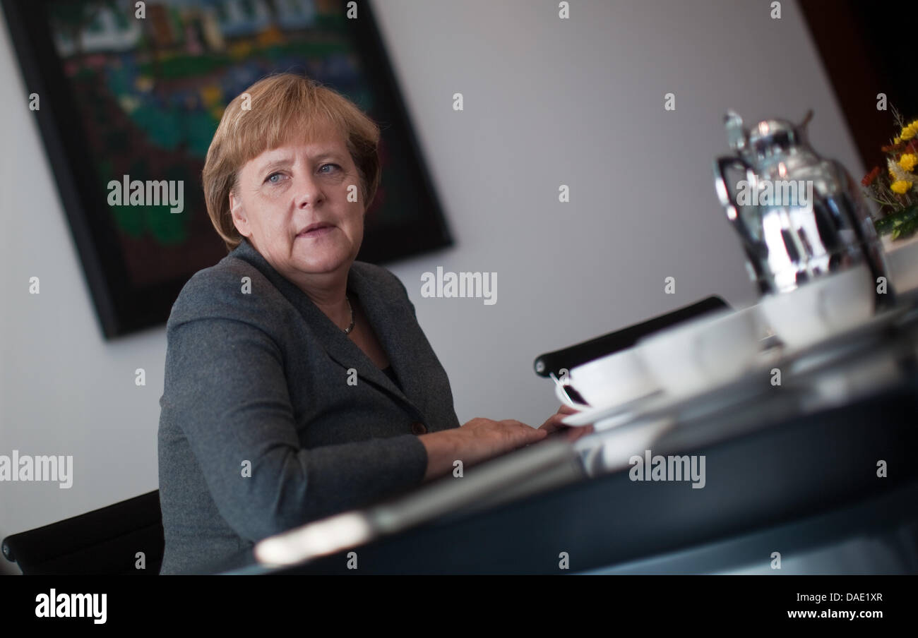 German Chancellor Angela Merkel speaks during an interview with the ...