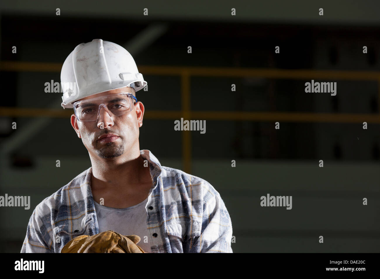 Mid adult construction worker wearing hard hat, portrait Stock Photo ...