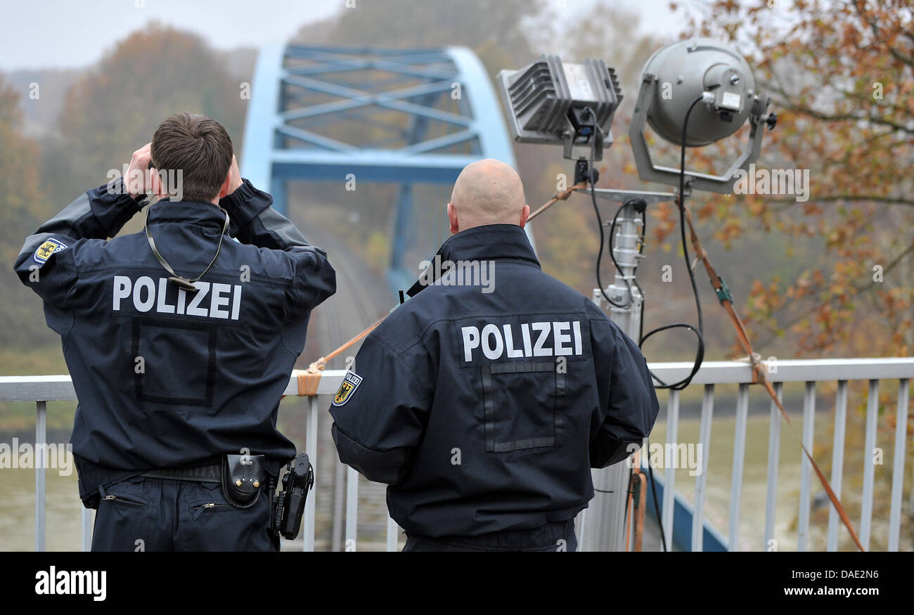 Federal police officers control the railway tracks prior to the ...