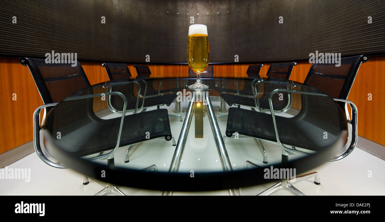 A full glass of beer stands on a conference table in Vienna, Austria ...