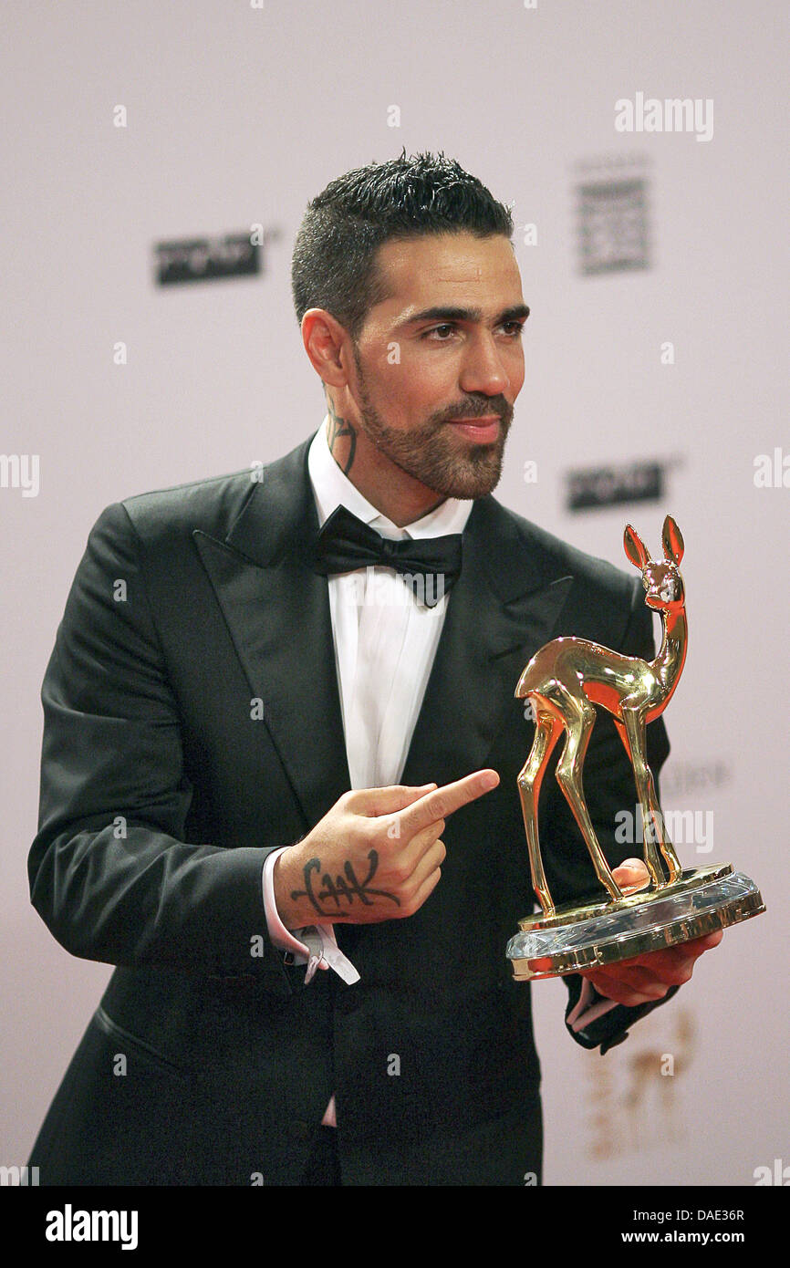 German singer Bushido poses with the 'Integration' Bambi trophy in the ...