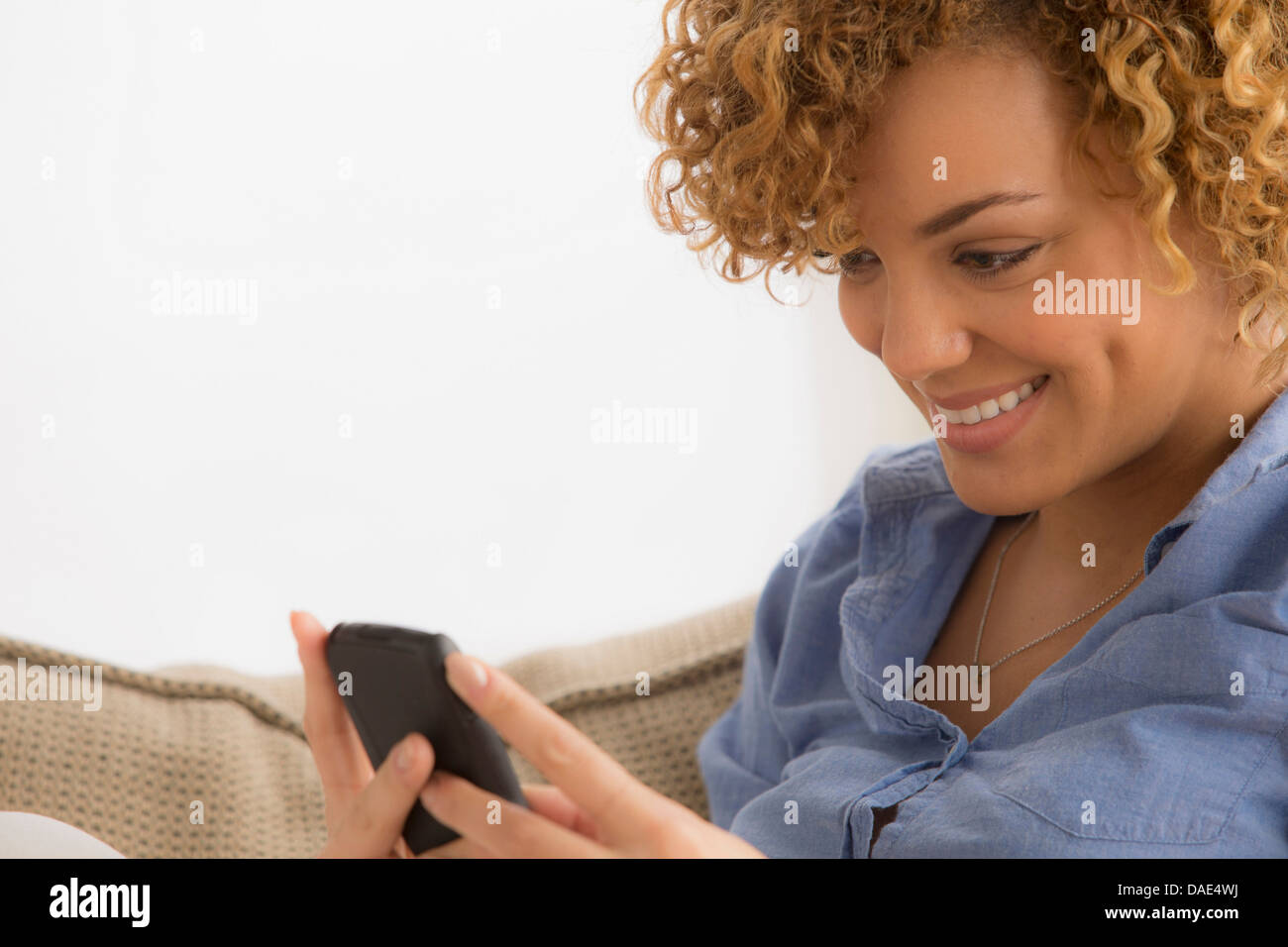 Woman using mobile phone, portrait Stock Photo - Alamy