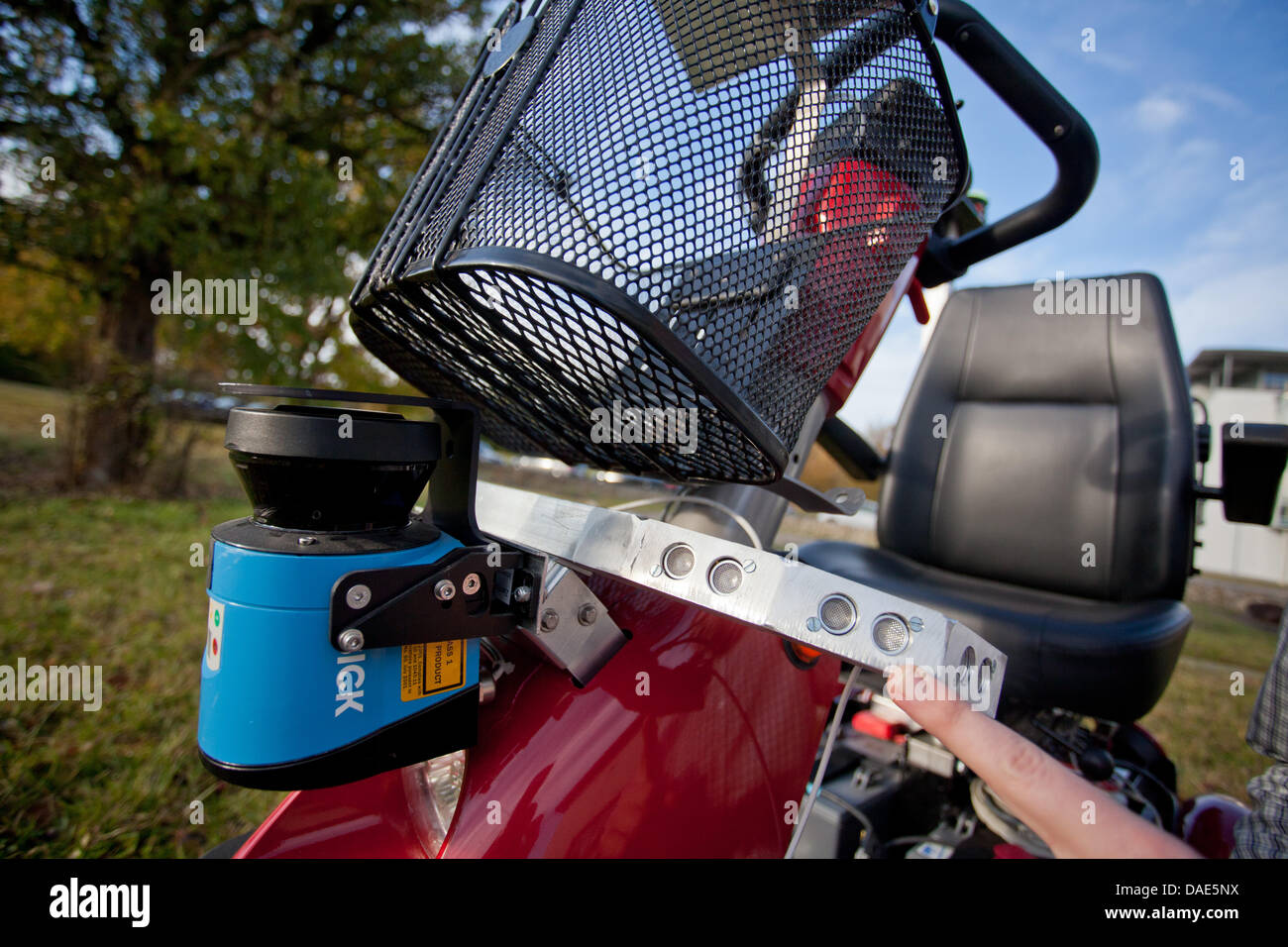 The postgraduate Daniel Eck points to sensors next to a control module ...
