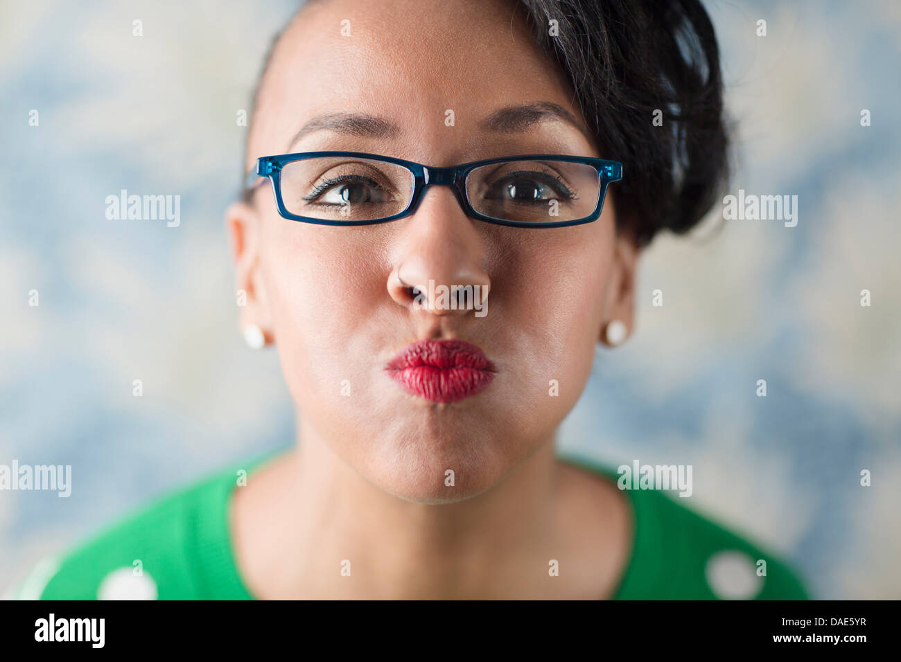 Close up portrait of woman puckering her lips Stock Photo - Alamy