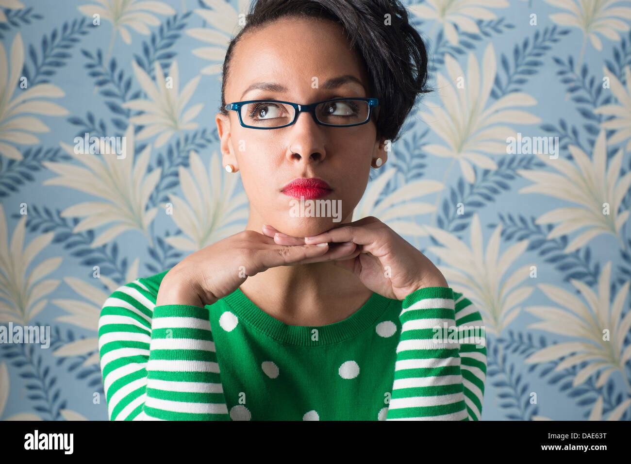 Retro style portrait of woman with hands holding chin Stock Photo - Alamy