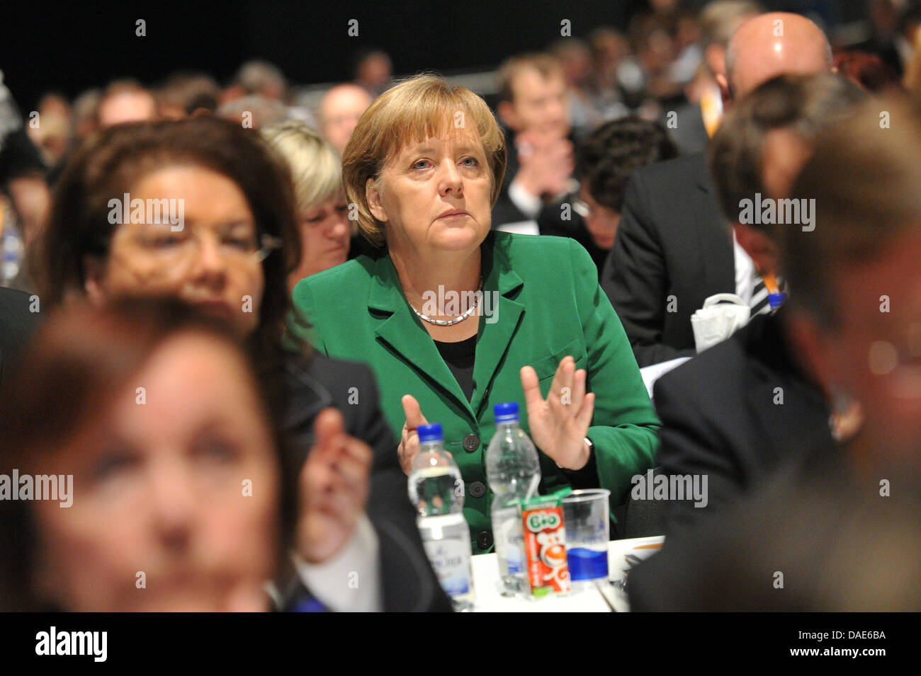 CDU federal chairwoman and German Chancellor Angela Merkel sits between ...