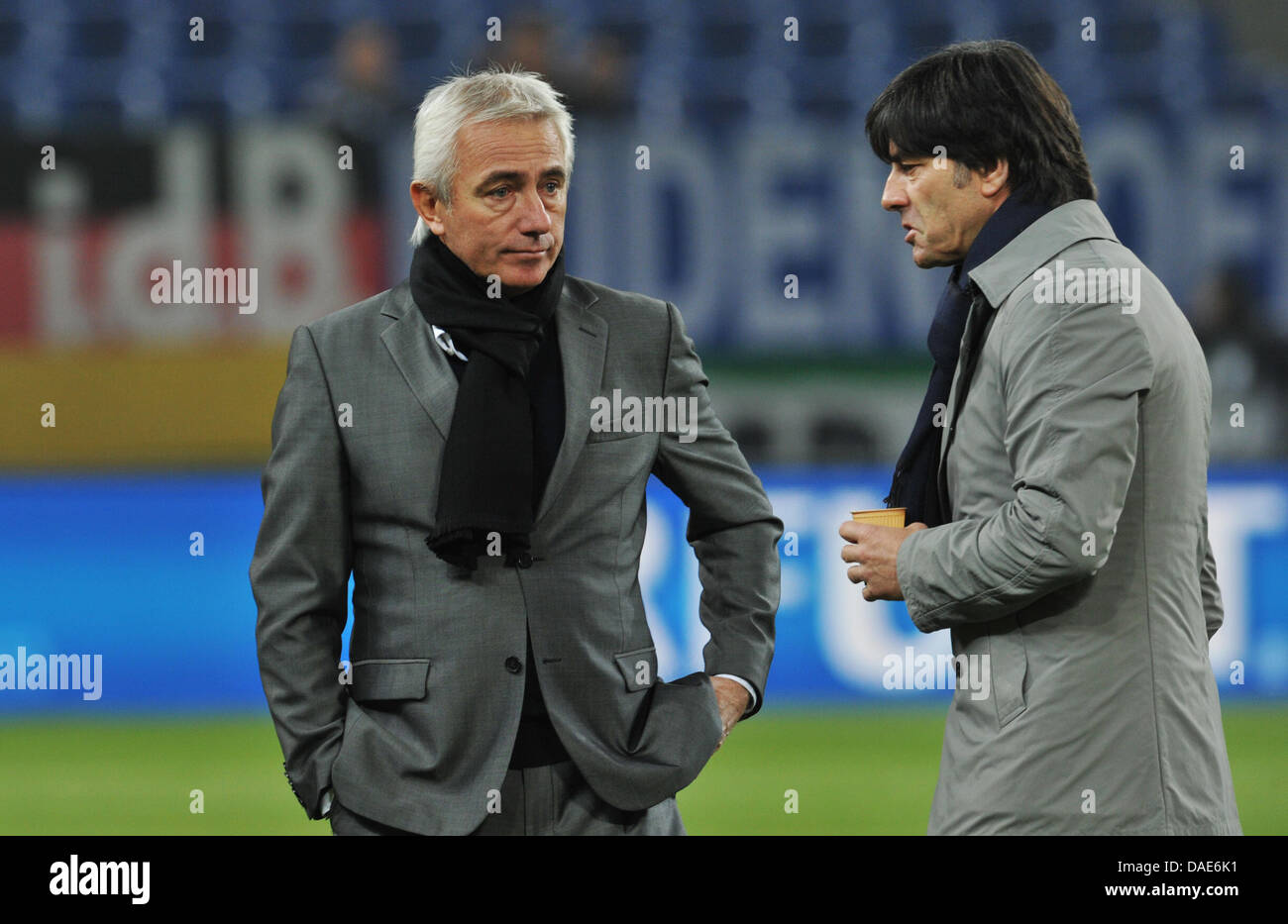 Germany's coach Joachim Löw (R) and Dutch coach Bert van Marwijk talk ...