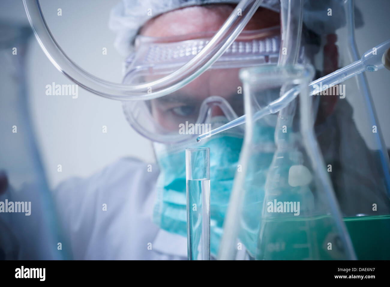 Scientist using pipette, close up Stock Photo - Alamy