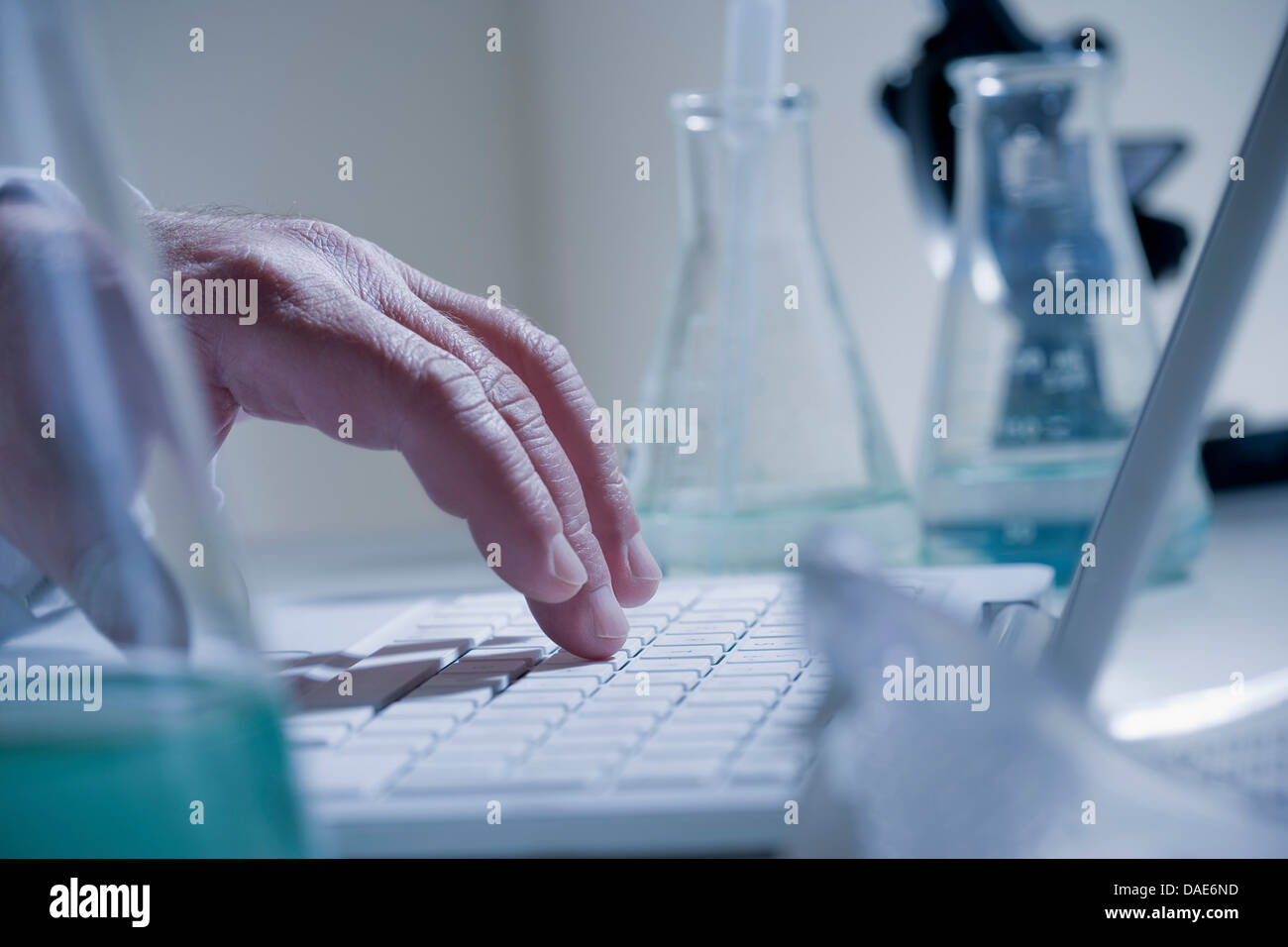 Scientist using laptop in laboratory Stock Photo - Alamy
