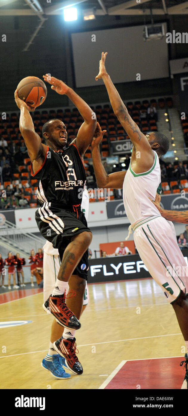 Munich's JeKel Foster (L) gets past one of Treviso's players during the ...