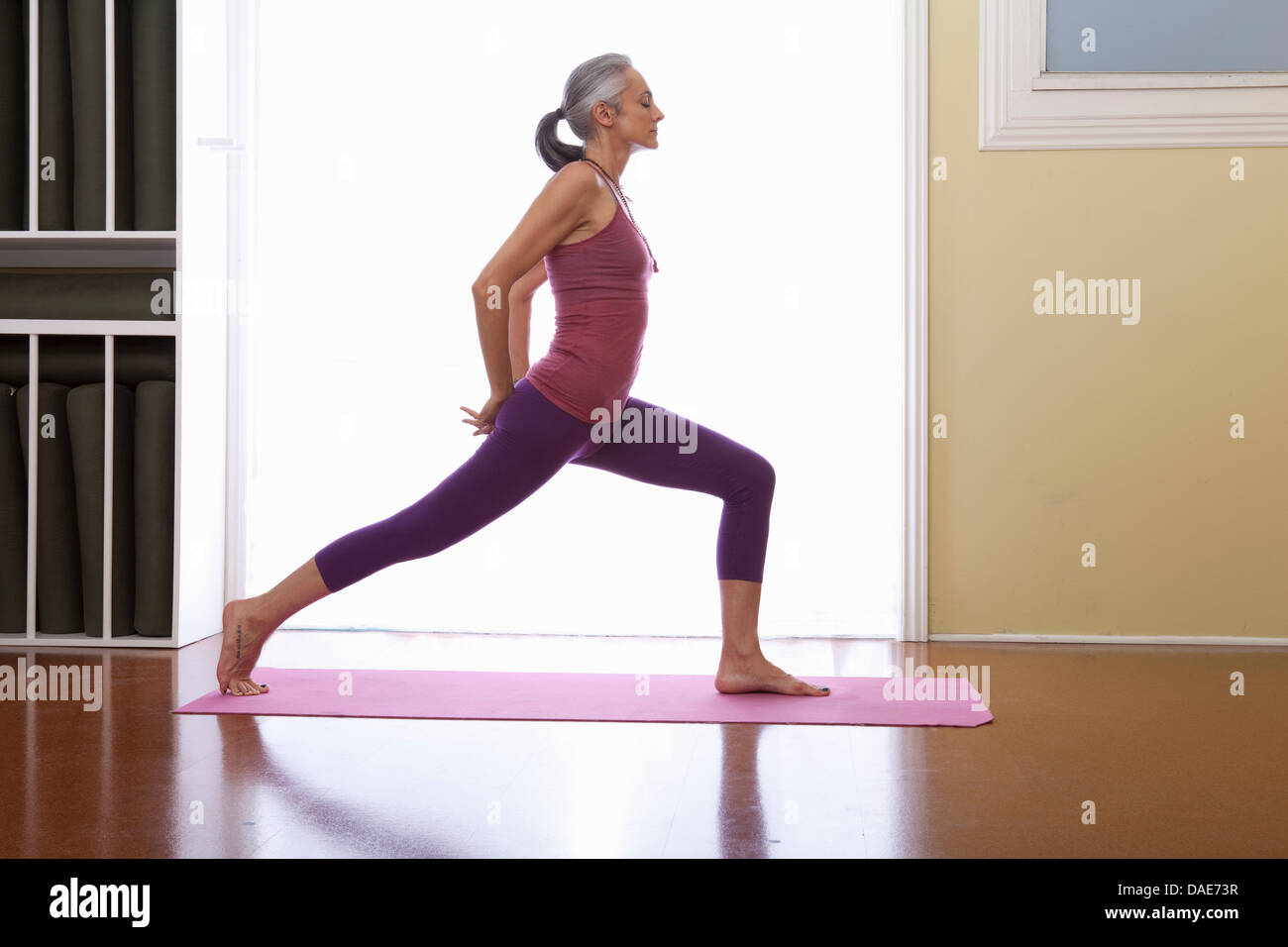 Stretching leg behind hi-res stock photography and images - Alamy