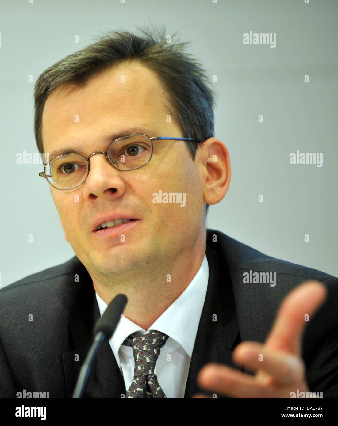 Chief financial officer of Infineon Dominik Asam speaks during a press ...