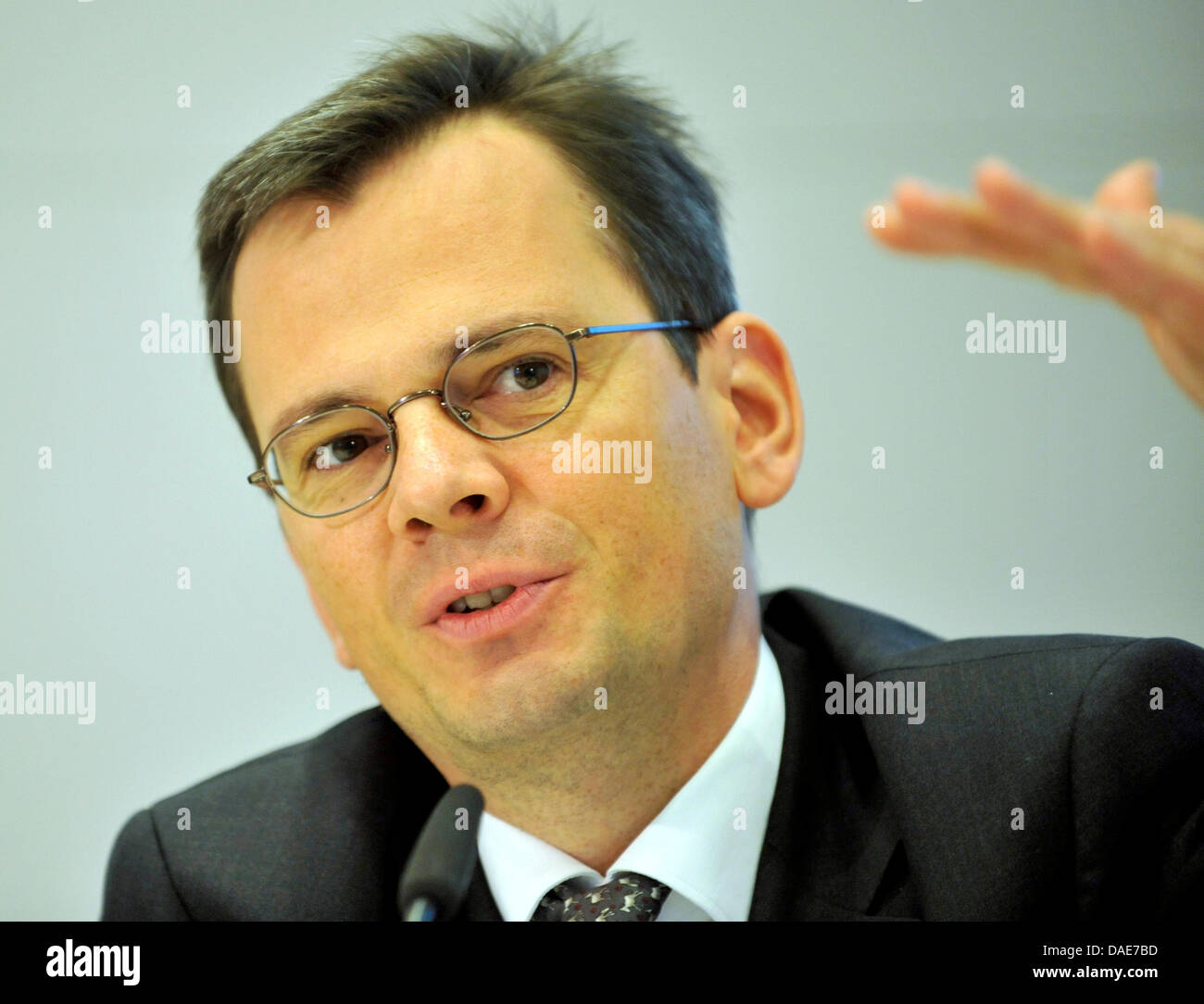 Chief financial officer of Infineon Dominik Asam speaks during a press ...
