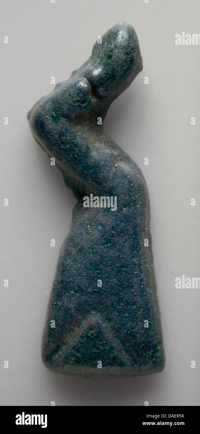 This amulet, crafted from bronze, features intricate casting and design ...