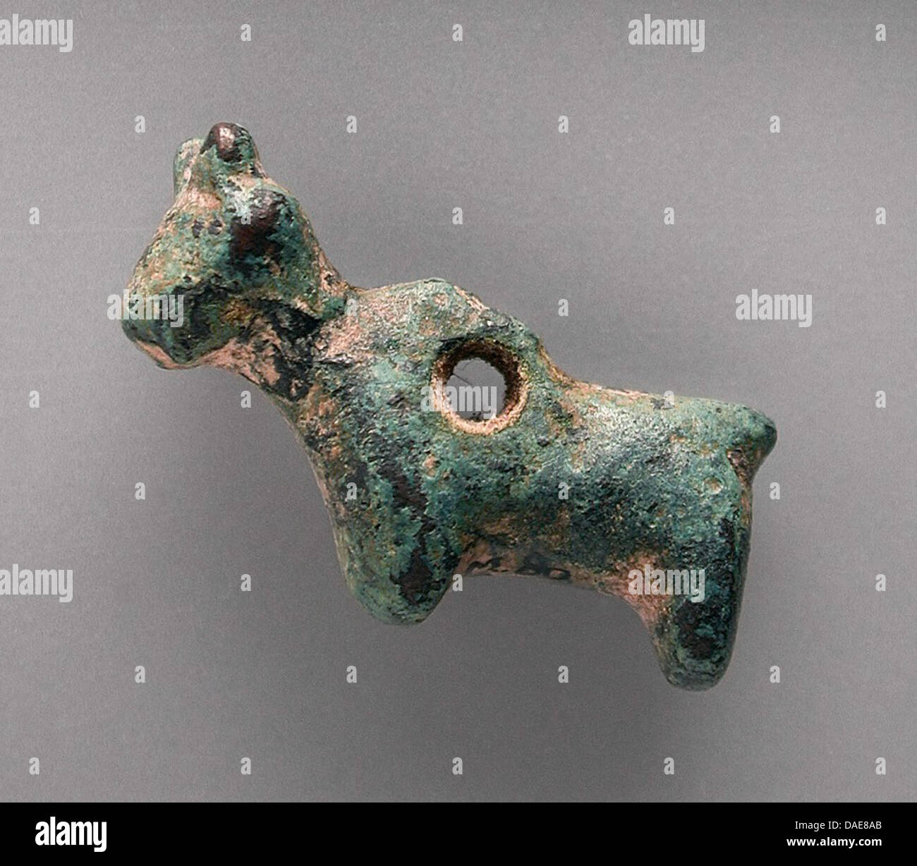 A ram-shaped amulet made of bronze, reflecting ancient symbolism and ...