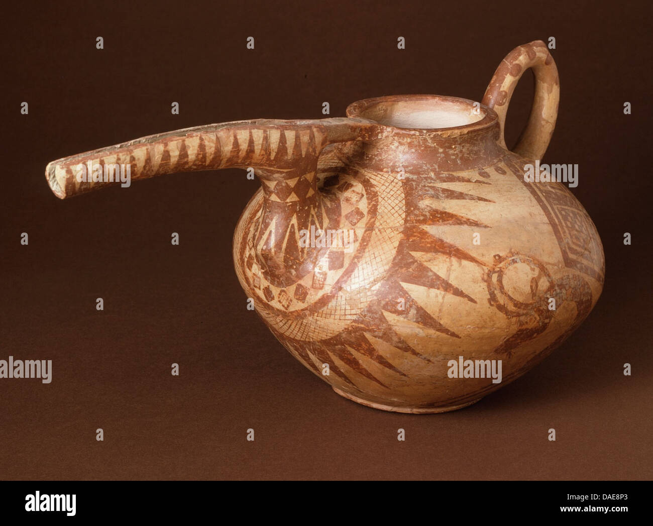 This beak-spouted pot is decorated with intricate painted designs ...