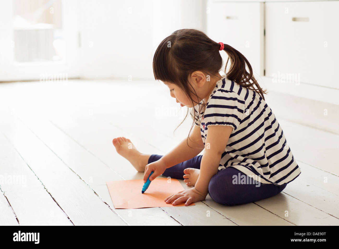 Child Drawing On Floor