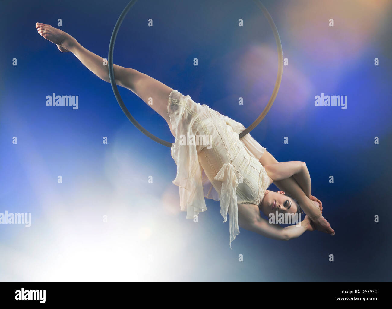 Studio shot of aerialist performing on hoop Stock Photo - Alamy