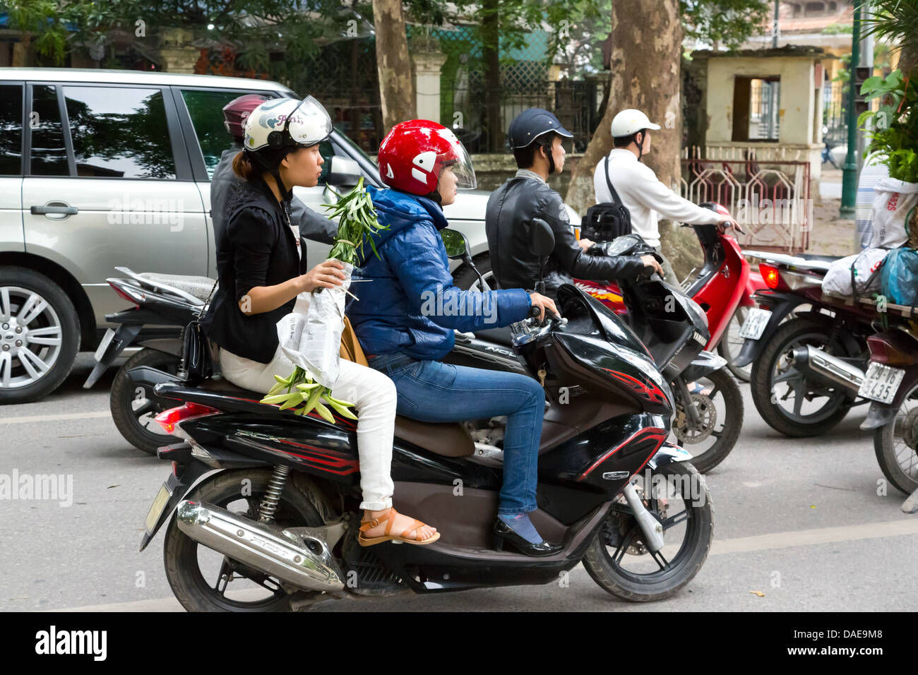 Scooter Drivers in Hanoi, Vietnam Stock Photo - Alamy