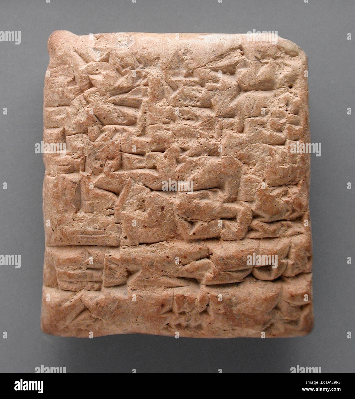 This ancient cuneiform tablet, inscribed on both sides, showcases the ...