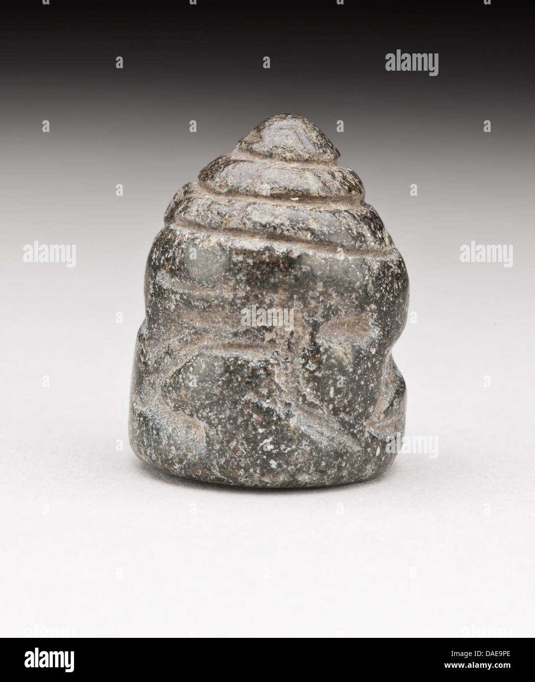 This cylinder seal is byre-shaped, typical of ancient Mesopotamian ...