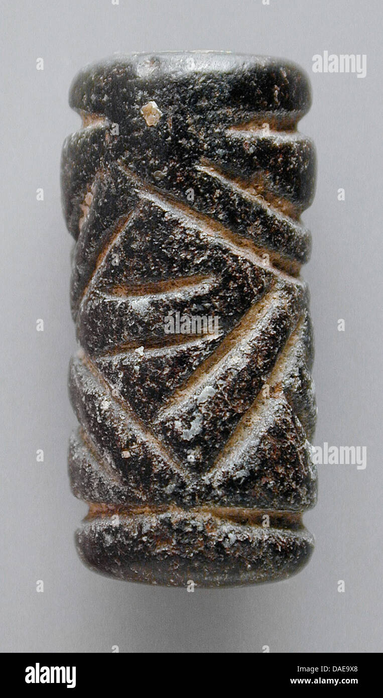 This cylinder seal features intricate engravings, typically used in ...