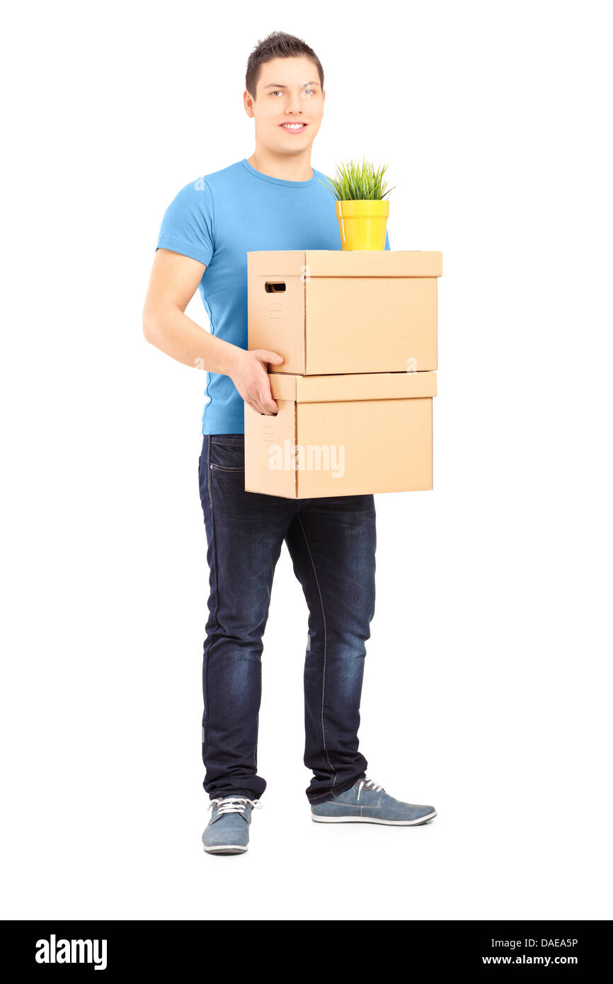 Full length portrait of a guy carrying removal boxes during moving into ...