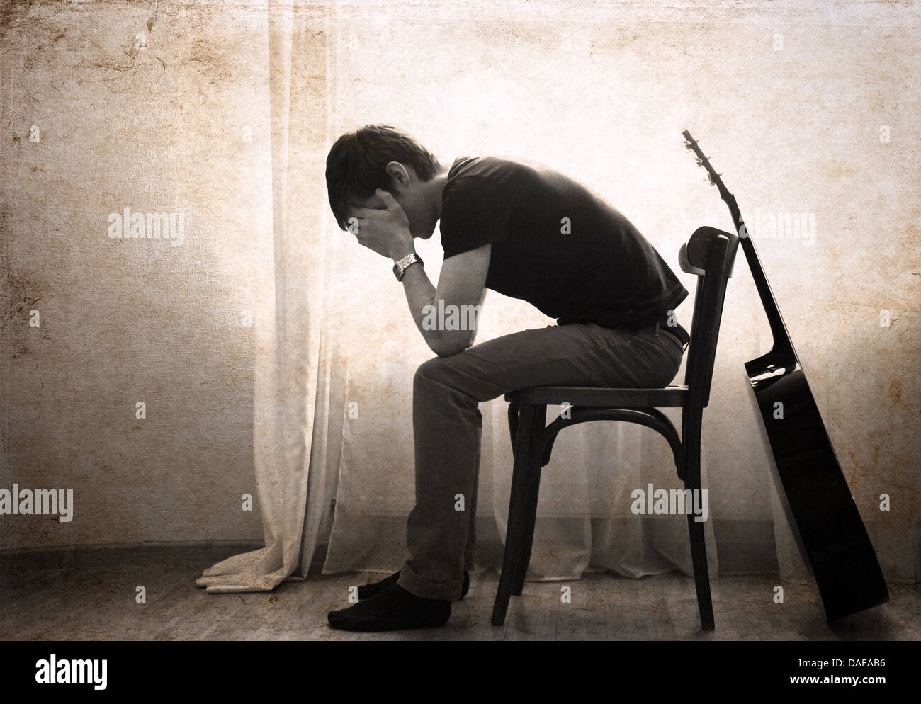 image in grunge style, sad man and guitar Stock Photo - Alamy
