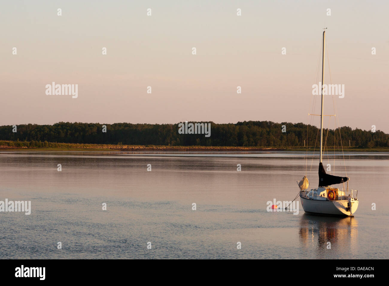 Sailboat at anchor on a sunny morning Stock Photo - Alamy