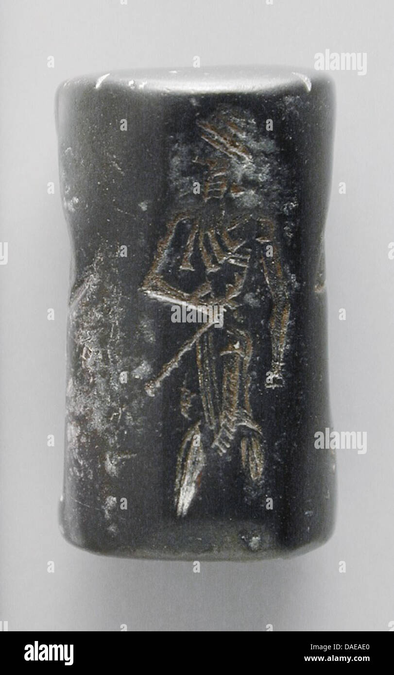 This ancient cylinder seal, made of stone, was used to create imprints ...