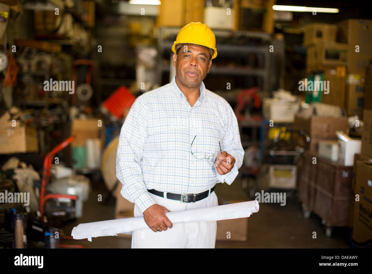 Man holding blueprint hi-res stock photography and images - Alamy