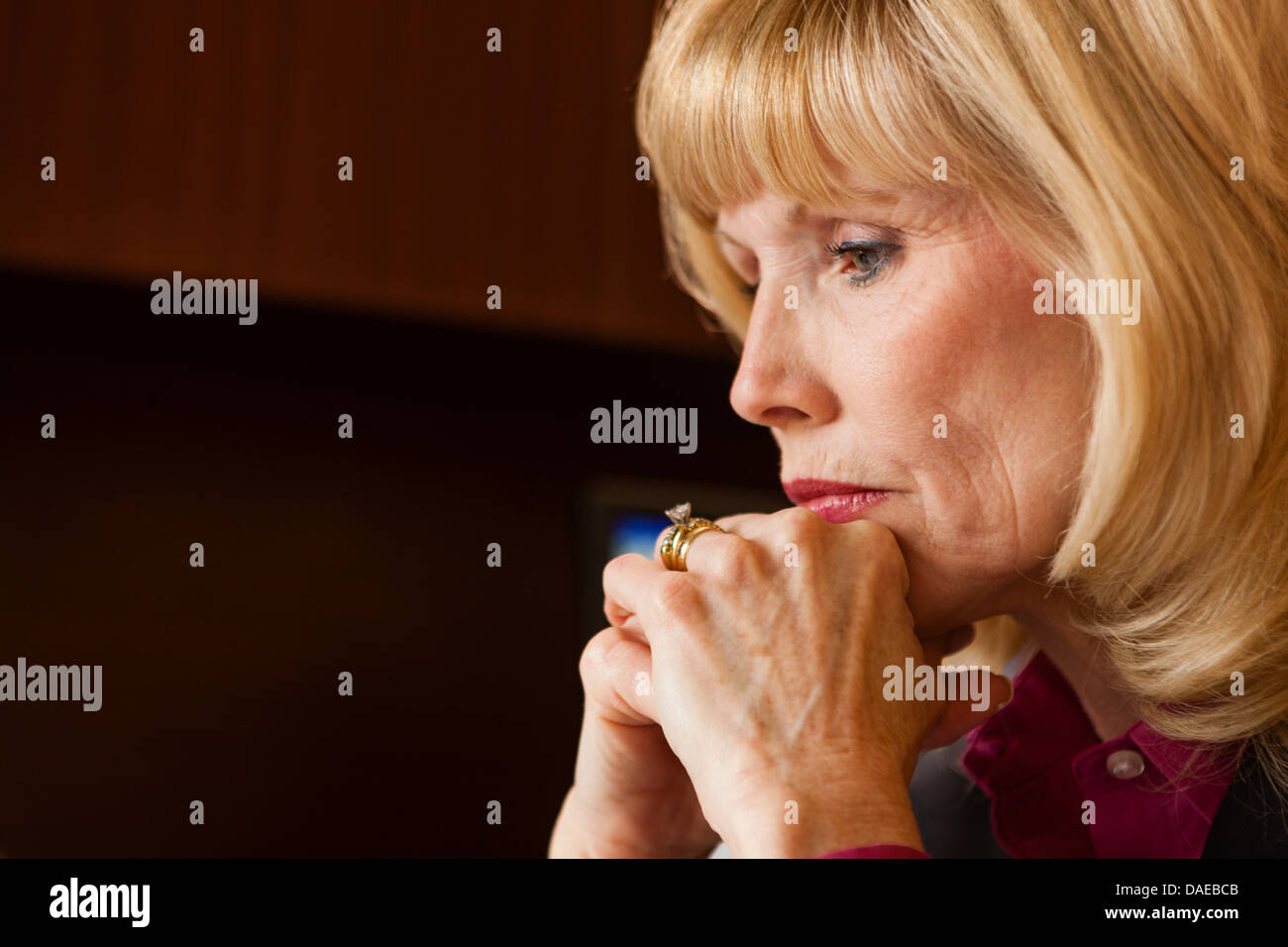 Close up portrait of mature woman looking pensive Stock Photo - Alamy
