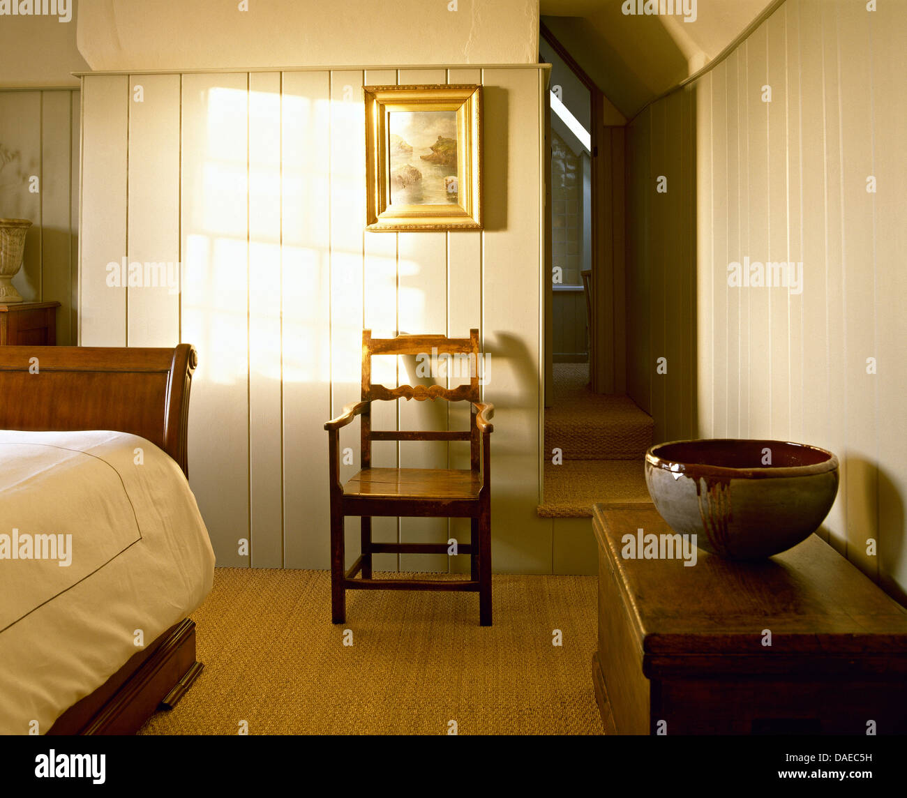 Antique wooden chair and chest of drawers with large pottery bowl in ...